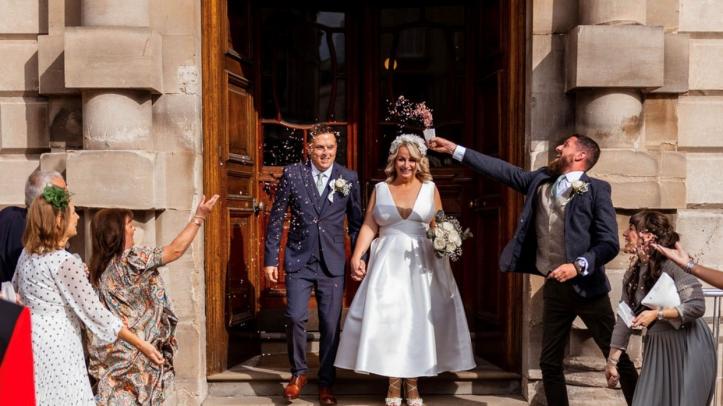 Newly wedded couple outside of Guildhall Bath
